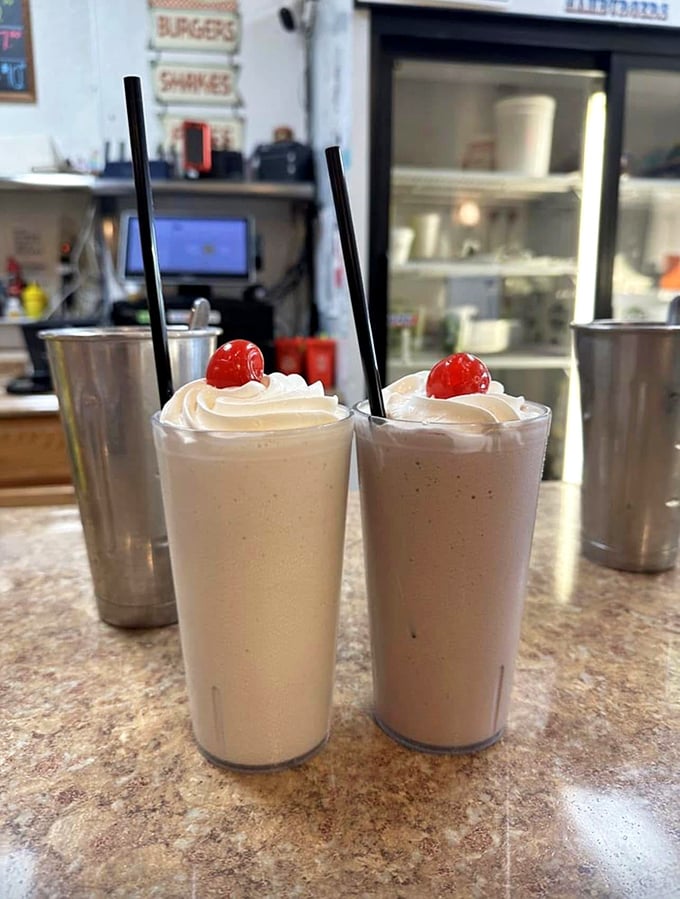 Milkshakes topped with whipped cream and cherries—thick enough to require serious straw commitment but worth every bit of the effort.