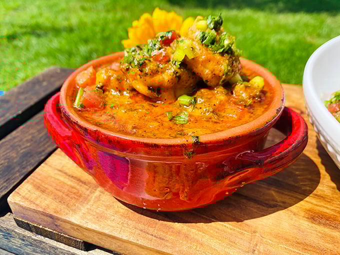 This vibrant shrimp dish isn't just food—it's a sunset in a bowl. The rich orange sauce promises flavors that dance across your palate.