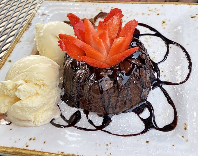 This chocolate lava cake doesn't just ooze – it erupts with molten goodness, proving dessert for breakfast is sometimes the only rational choice.
