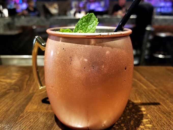 Even the Moscow Mule gets the California treatment – copper mug, fresh mint, and the promise of refreshment after a serious barbecue session.