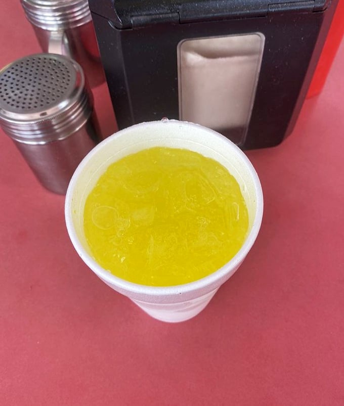 Even the Mountain Dew looks more vibrant against CJ's signature red tables—the perfect sweet counterpoint to the savory feast that awaits.