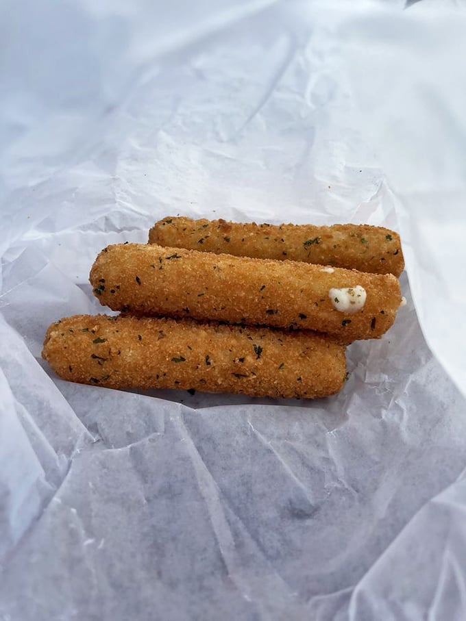 Mozzarella sticks: where the stretch between your mouth and the plate becomes a delicious tug-of-war that nobody minds losing.
