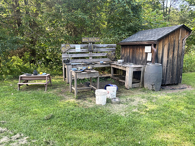This rustic mud kitchen proves outdoor play predates video games by millennia. Creative mess-making encouraged, screen time zero, childhood memories infinite.