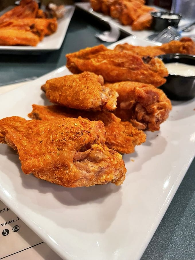 These wings aren't just spicy—they're a coastal Virginia handshake, Old Bay seasoning creating a flavor profile that bridges Irish tradition with Chesapeake Bay attitude.