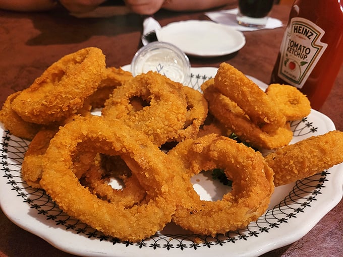 Onion rings with the perfect crunch-to-tenderness ratio. These golden halos aren't just appetizers—they're the jewelry of the comfort food world.