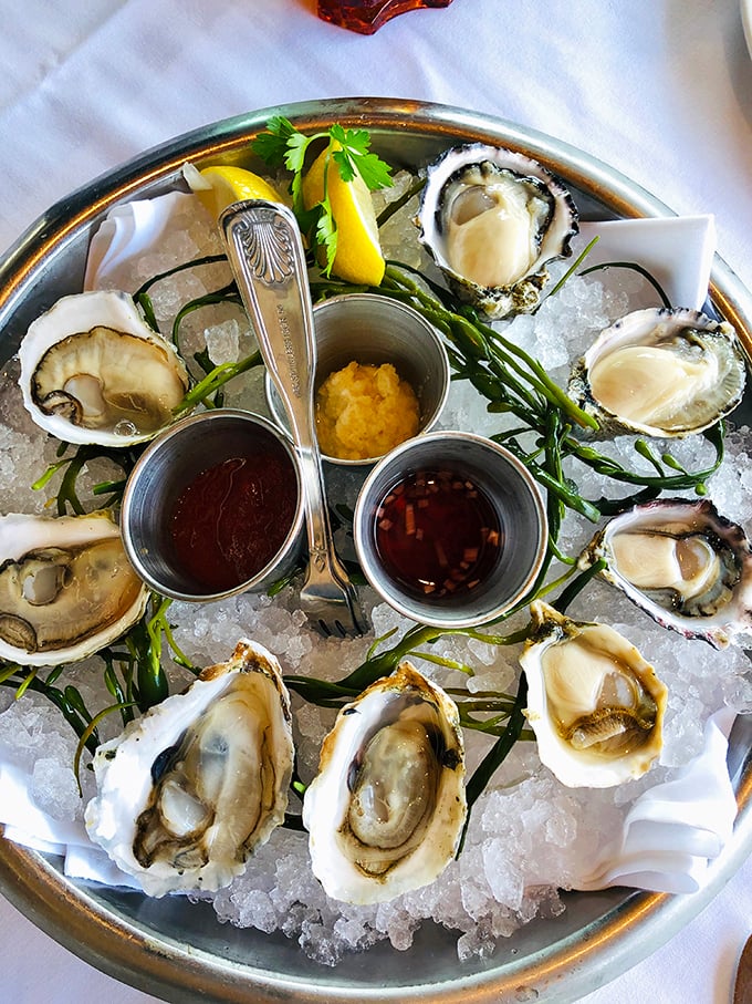 Oysters on ice – nature's perfect appetizer. Each one a small ocean adventure, complete with mignonette sidekicks ready for the journey.
