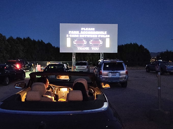 "Please park accordingly"—drive-in etiquette hasn't changed since the days of poodle skirts and leather jackets.