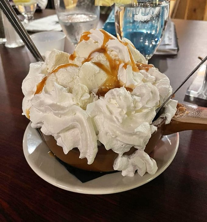 This isn't just dessert—it's a mountain of whipped cream with caramel drizzle that requires its own zip code. Spoons at the ready!