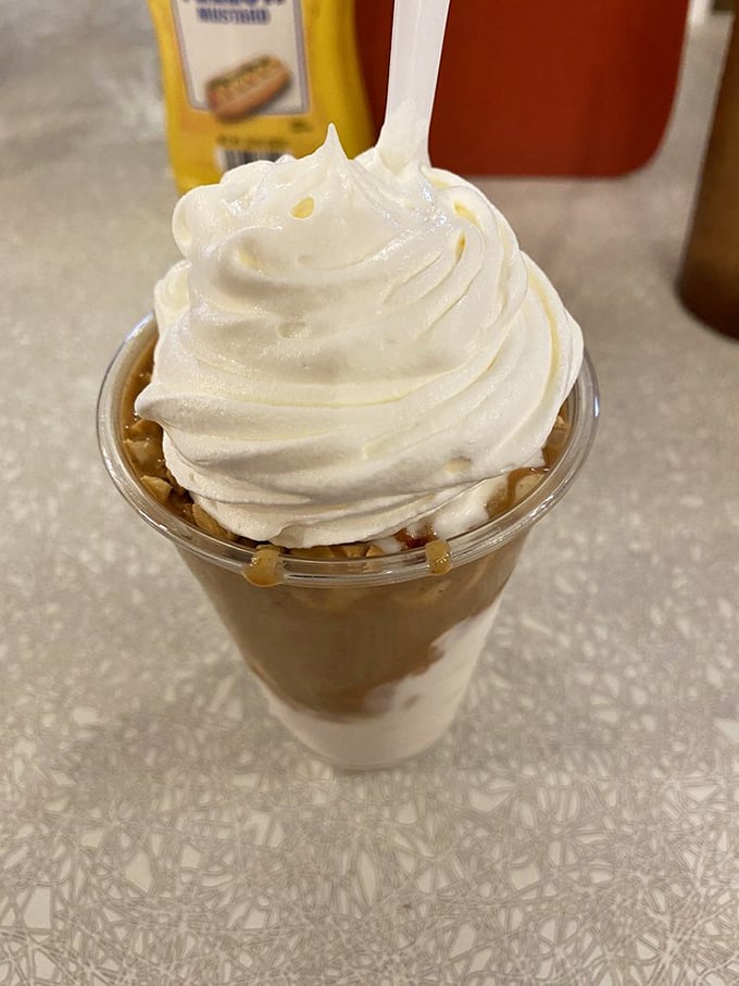 The peanut butter sundae doesn't just satisfy a sweet tooth—it throws a full-blown celebration for it, complete with whipped cream party hats.