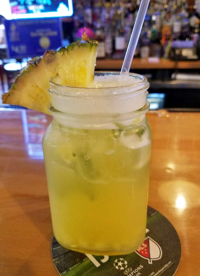 That pineapple coconut mojito looks like vacation in a glass – tropical escape meets Philadelphia barbecue joint perfection.