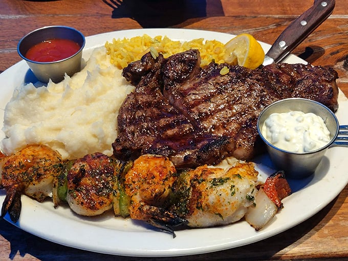 When land meets sea on a single plate: a perfectly grilled steak alongside succulent shrimp skewers proves that surf and turf isn't just a meal—it's a philosophy.