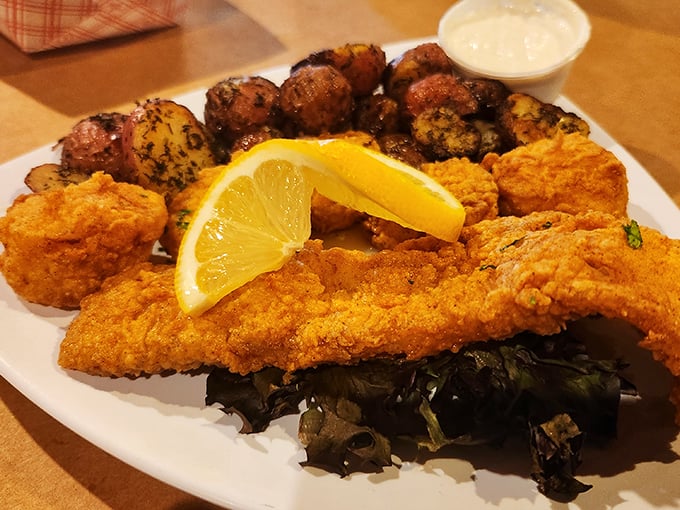 Golden-fried fish, seasoned potatoes, and a splash of green—a plate that whispers "vacation" even on a Tuesday.