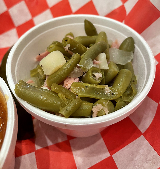 Green beans swimming with bits of pork—because at Fatback's, even the vegetables get a meaty makeover worth writing home about.