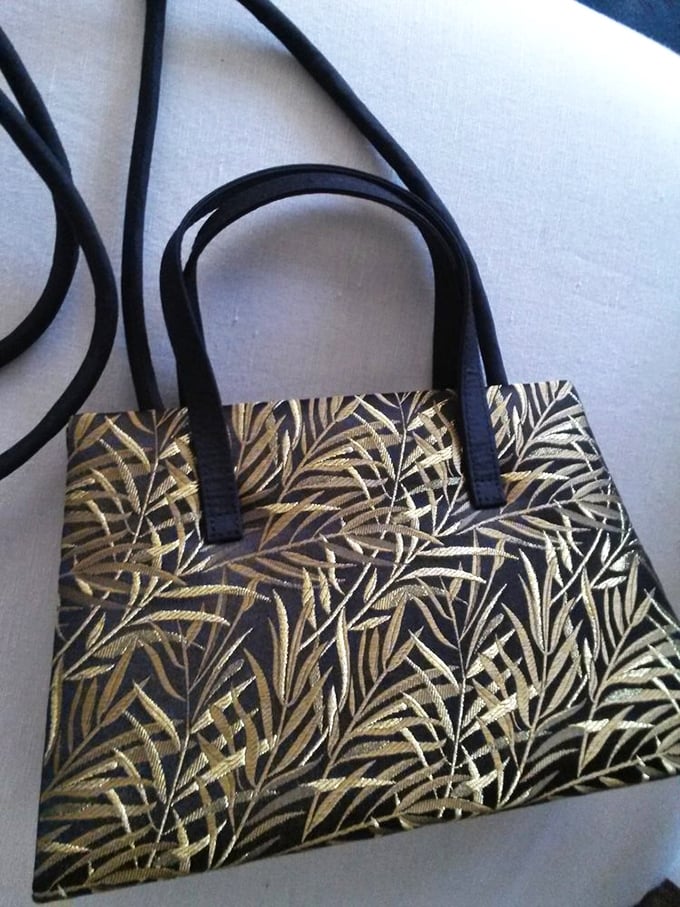 Embroidered elegance meets practical portability. This gold-leaf patterned handbag proves someone else's "no longer sparks joy" might become your signature accessory.