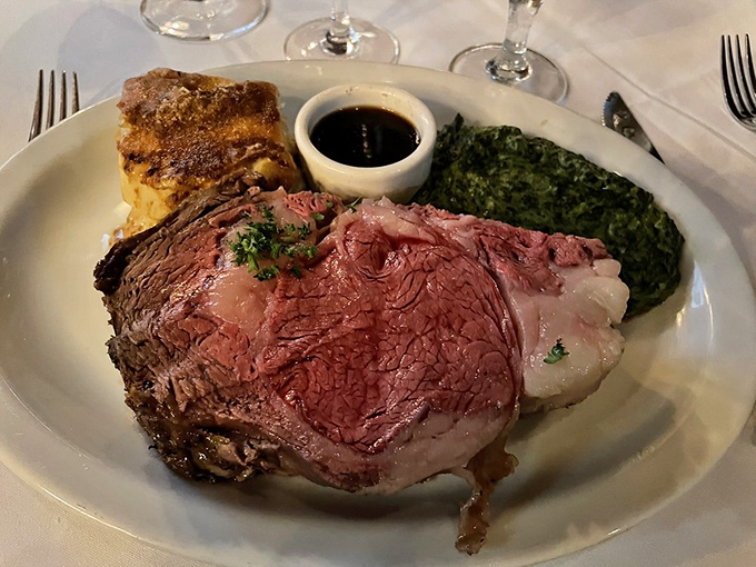 Prime rib that's pink in all the right places, accompanied by creamed spinach and Yorkshire pudding – it's like the British Empire and American steakhouse tradition had a delicious baby.