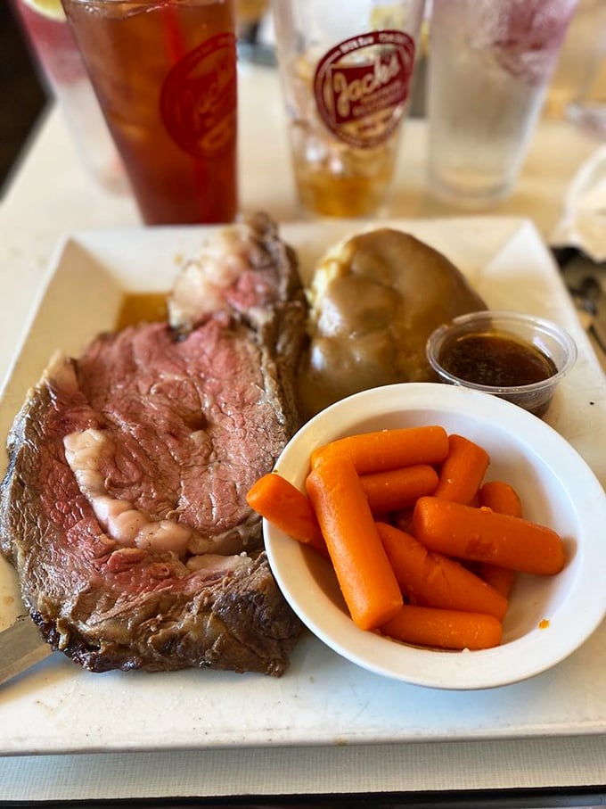 Prime rib cooked to that perfect rosy medium—the kind that makes vegetarians momentarily question their life choices.