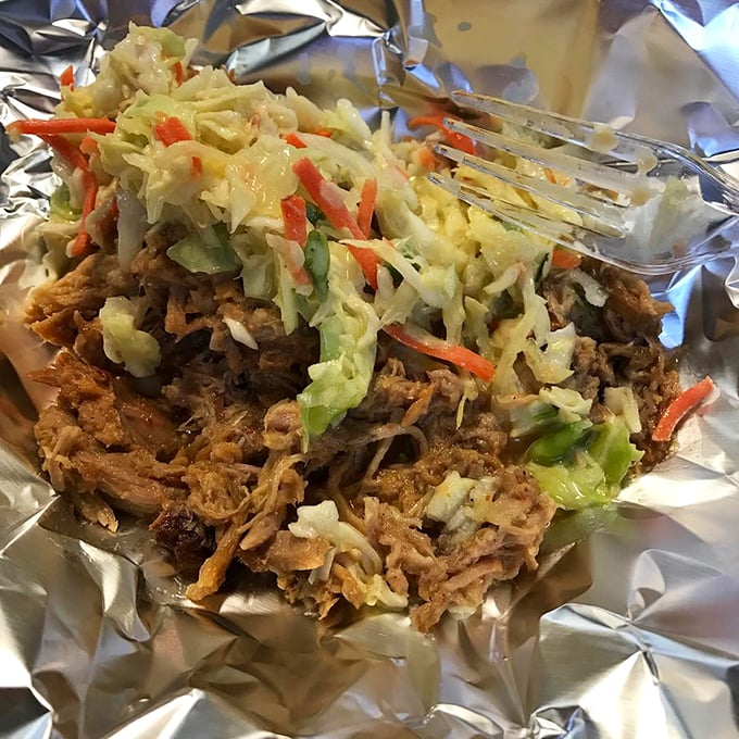 The perfect marriage – tender pulled pork crowned with crisp, colorful slaw creates a textural symphony that makes your taste buds stand up and applaud.