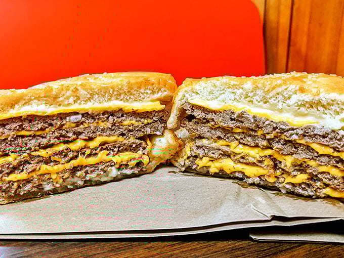 Not all heroes wear capes—some come stacked four patties high with cheese layered between each one. This isn't a meal; it's a monument to American excess.