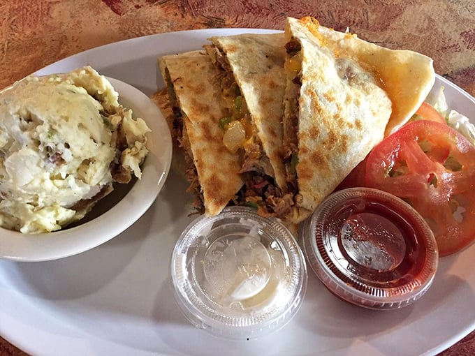 Quesadillas that bridge cultures – crispy, gooey, and stuffed with enough filling to make your cardiologist wince and your taste buds applaud.