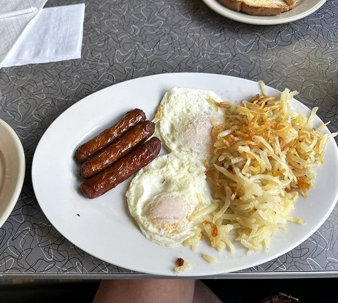 The Reuben sandwich – where corned beef, sauerkraut and Swiss cheese perform a perfectly choreographed dance. Those fries are ready for their supporting role.
