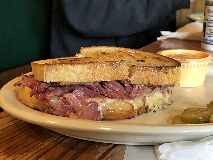 The Reuben sandwich—where corned beef, sauerkraut, and grilled rye bread come together in a harmony that would make any deli proud.