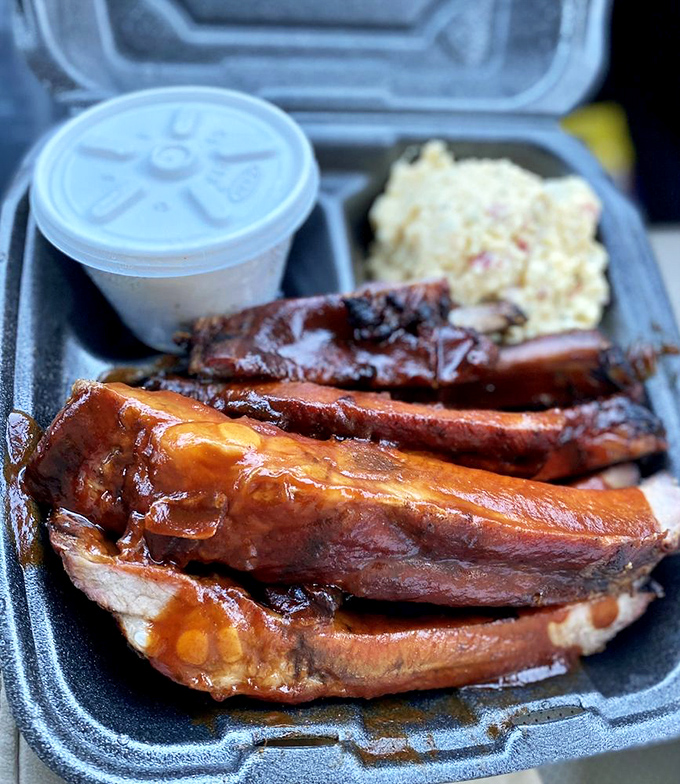 These ribs aren't falling off the bone—and that's exactly right. Perfect barbecue ribs should have just enough bite to remind you you're eating something substantial.