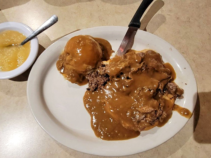 Smothered roast beef that doesn't need a knife – the gravy alone should have its own fan club and merchandise line.