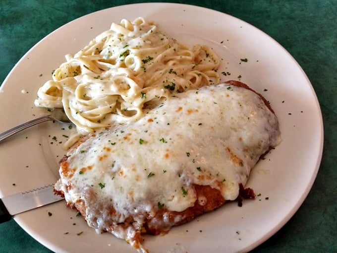 Chicken parmesan with a side of fettuccine that's clearly not counting calories. This plate doesn't just feed your body—it hugs your soul.