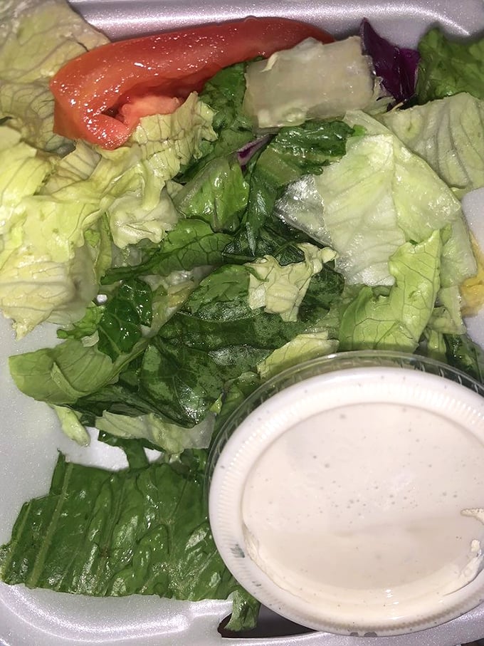 A simple salad that knows its role—the opening act that refreshes the palate before the headliner arrives at your table.