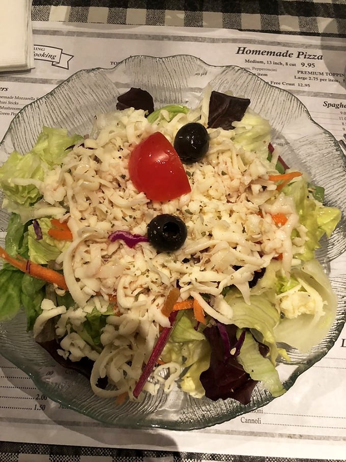 Even the house salad gets the respect it deserves, a crisp counterpoint to all that glorious cheese and sauce.