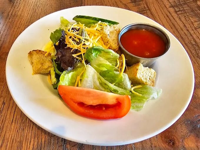 Even the salad looks like it's from a simpler time – when vegetables knew their place and croutons were considered a major food group.