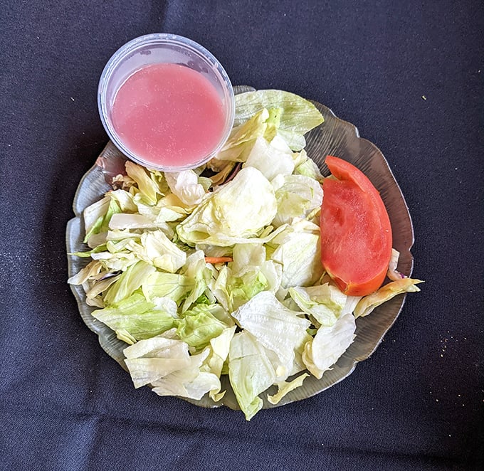 A salad that knows its role in the steakhouse experience—humble yet necessary, like the opening act for a legendary rock band.
