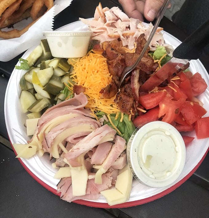 This isn't just a salad – it's a colorful celebration of fresh ingredients that somehow holds its own in a temple of comfort food.