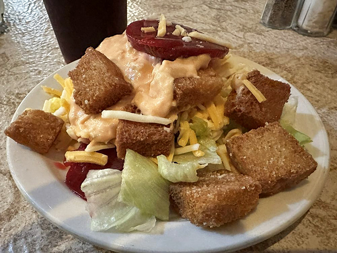 A salad that makes you question if vegetables can be comfort food too—spoiler alert: when topped with croutons and dressing, absolutely yes.