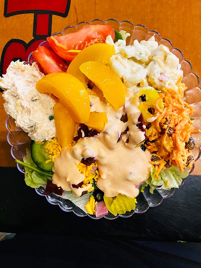A salad that doesn't apologize for being delicious. Those peach slices aren't just garnish – they're Georgia's signature waving hello.