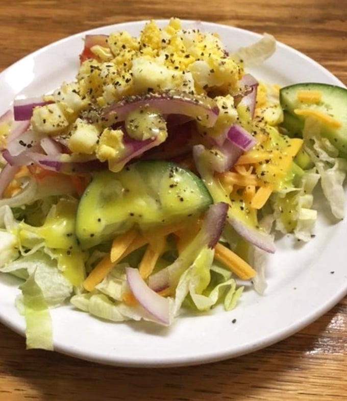A garden-fresh salad that proves vegetables can have personality too. Those crisp cucumbers and red onions aren't just toppings – they're supporting characters in your meal's story.