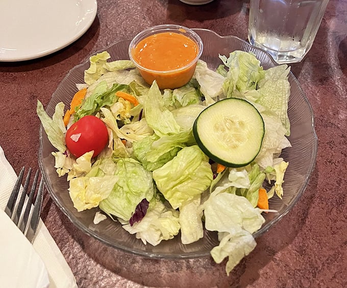 A simple house salad that knows its role – the opening act that sets the stage without stealing the spotlight from what's to come.