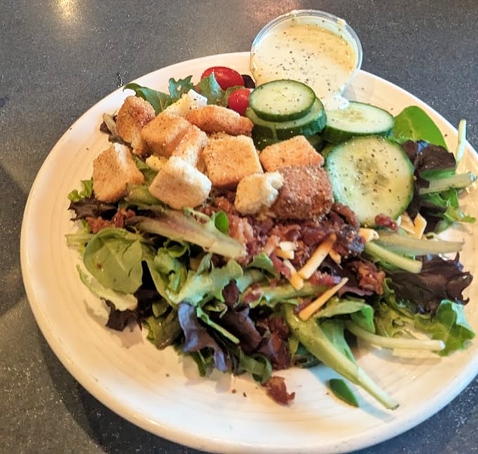Even their salads have Southern charm—crisp greens playing host to a party of toppings that make eating vegetables feel like cheating.