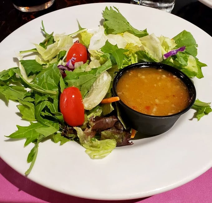 A fresh garden salad that's not just the obligatory green thing before the meat arrives—it's actually worth saving room for.