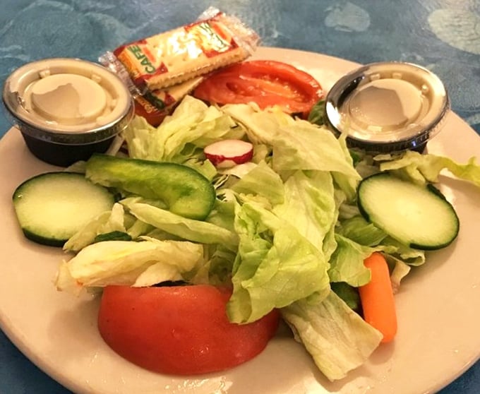 Even the salad deserves attention—crisp, fresh, and vibrant. It's the palate cleanser that respects itself enough to be more than an afterthought.