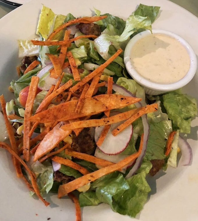 A salad that doesn't apologize for being healthy. Those crispy carrot strips add texture that makes virtuous eating feel indulgent.