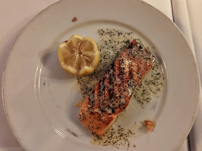Salmon that's been kissed by herbs and flame, then plated with the simplicity that only comes from absolute confidence.