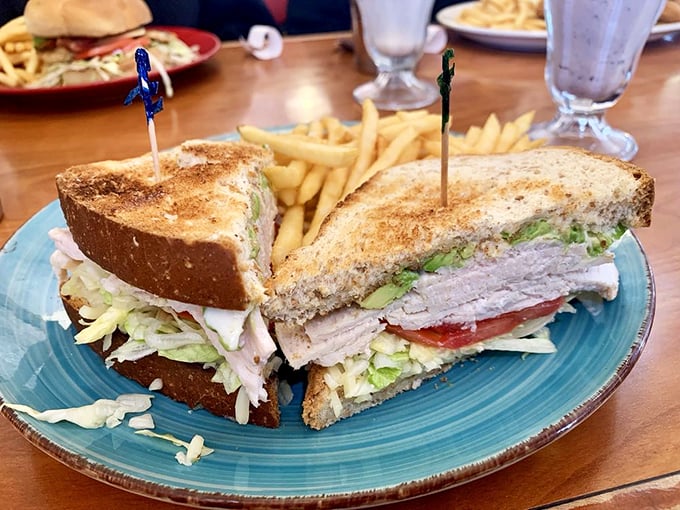 A sandwich so perfectly constructed it could teach architecture classes. The cross-section reveals layers of flavor that tell a story with each bite.