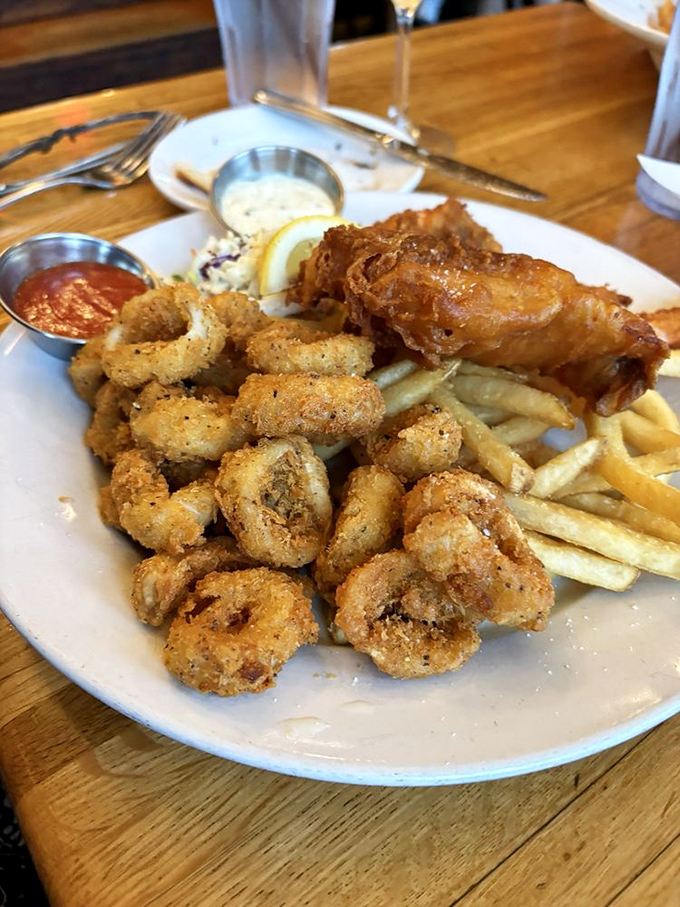 The Fisherman's Platter – where fried calamari, fish, and shrimp gather to make your taste buds throw a standing ovation. Golden, crispy seafood nirvana.