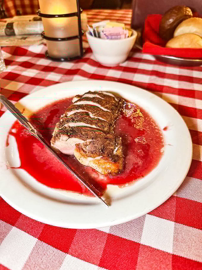 Duck breast swimming in raspberry zinfandel sauce—where frontier tradition meets culinary sophistication. The lavender rub is pure genius.