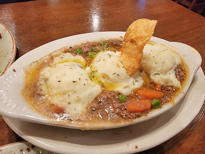 Shepherd's Pie that could end wars. Steam rises from this bubbling cauldron of savory meat and vegetables crowned with peaks of golden mashed potatoes.