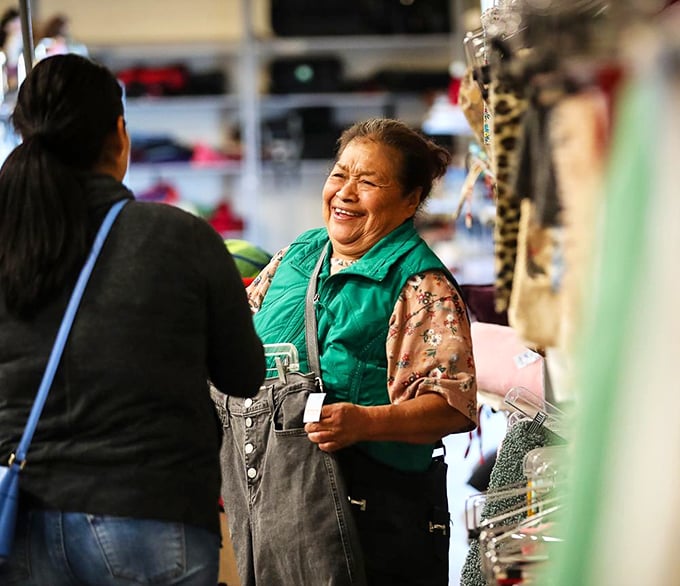 The joy of discovery transcends age and background. These shoppers share that universal "I found something amazing" smile that makes thrifting so addictive.