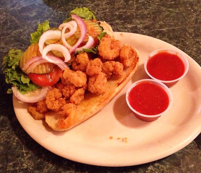 This po-boy isn't poor in any sense that matters. Crispy fried shrimp nestled in a soft roll with fresh veggies—a Gulf Coast classic done right.
