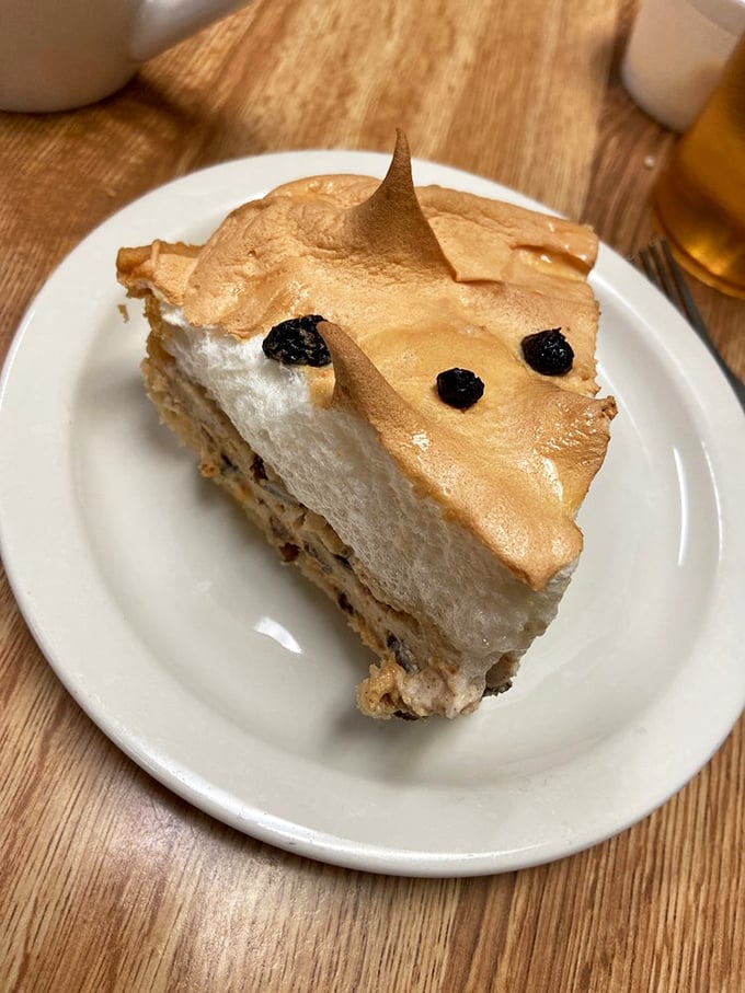Meringue that defies gravity atop what appears to be a classic cream pie. The perfect marriage of texture and flavor.