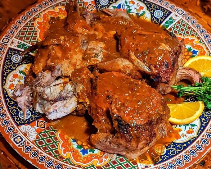 A symphony of tomatoes, peppers, and secret spices creates a sauce that hugs every inch of this chicken—proof that sometimes the messiest dishes taste the most magnificent.